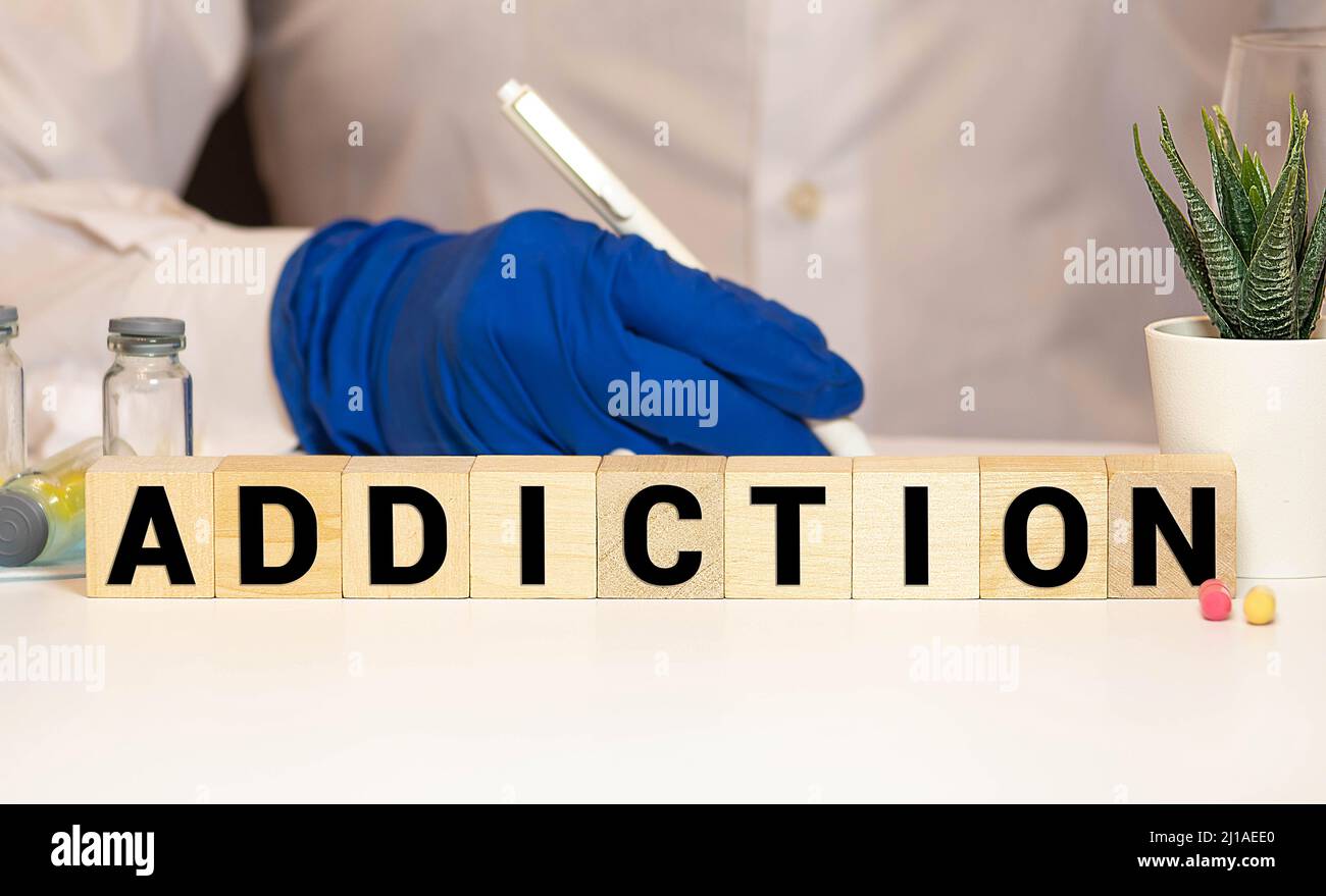 ADDICTION word made with building blocks, concept Stock Photo - Alamy