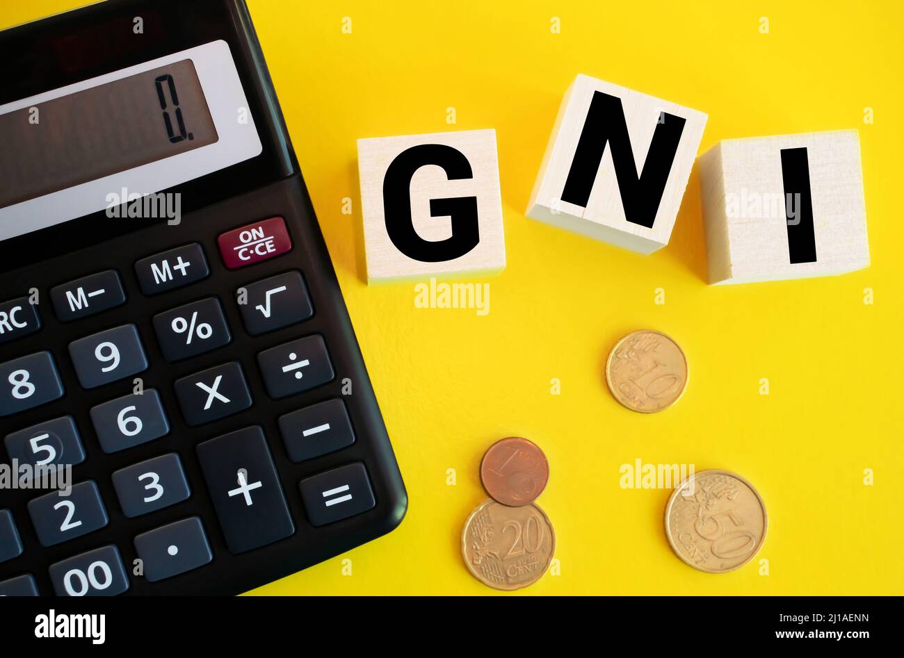 Wooden blocks with the word Gni and up arrow. Gross national income is ...