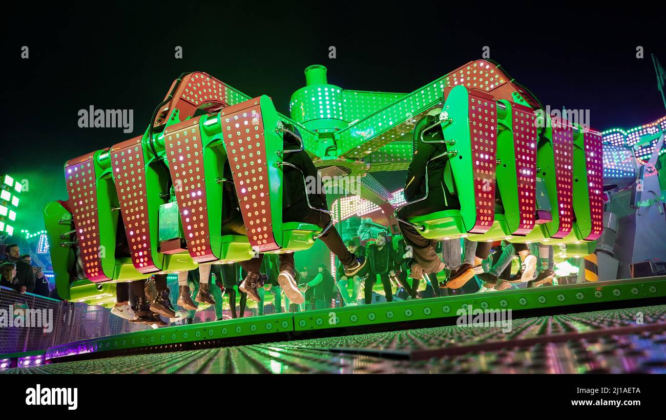 Funfair at night with ride Stock Photo - Alamy
