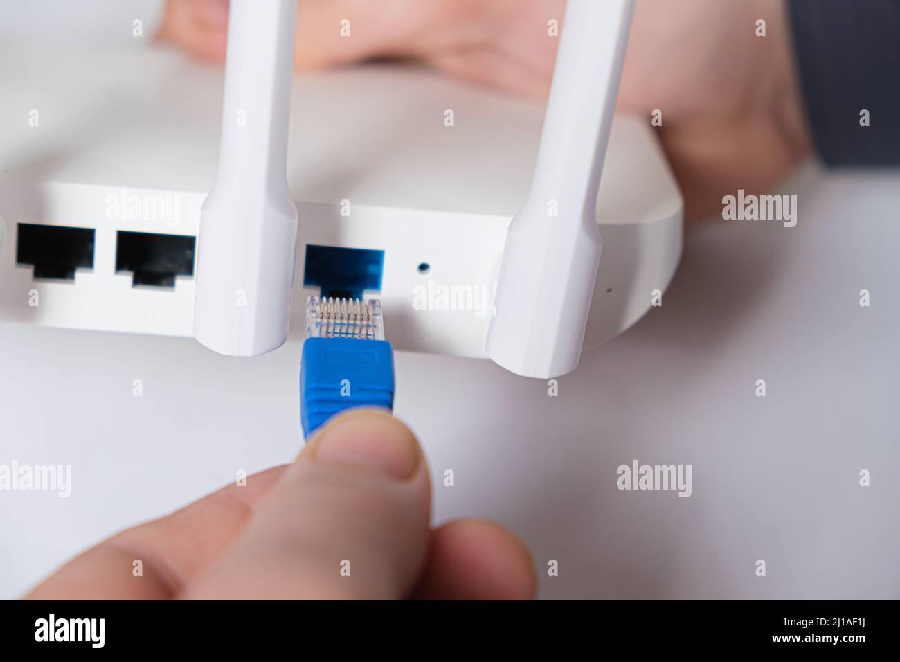 The wizard inserts the Internet cable into the Wi-Fi router. Internet ...