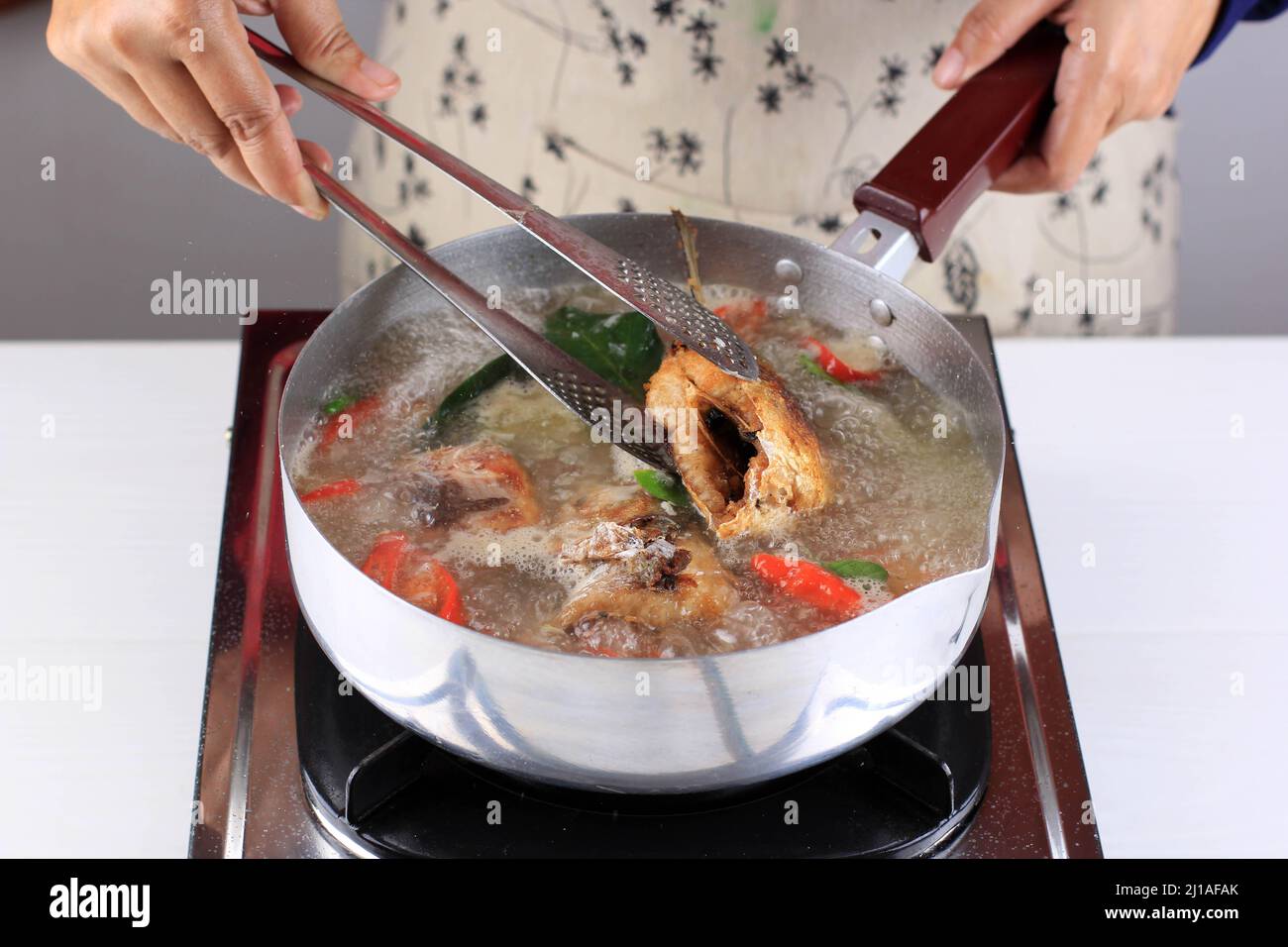 Put Frying Milk Fish (Bandeng) to the Soup in the Pan, Step Making Sop ...