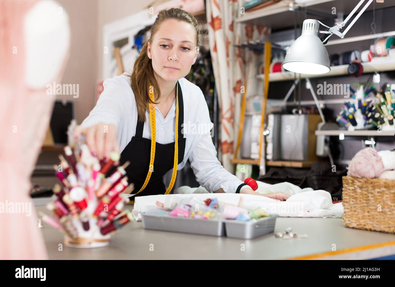 Portrait of woman designer who is doing new pattern for dress Stock ...