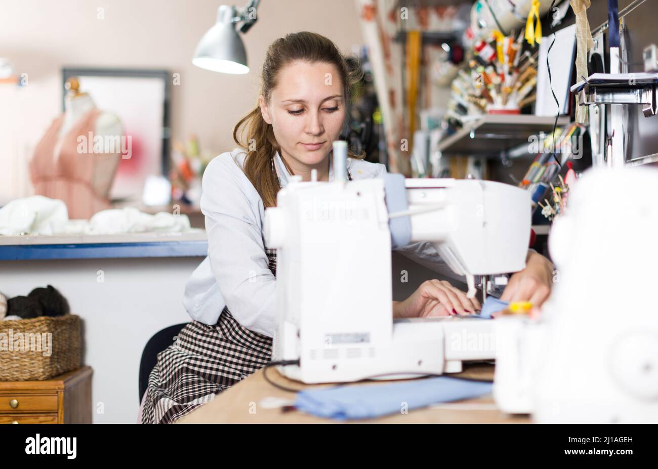 Portrait female dressmaker sewing hi-res stock photography and images ...