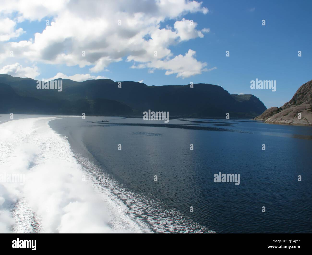 Back view in the ferry keel water in the fjord in Norway Stock Photo ...