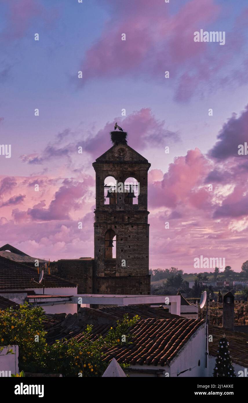 A vertical shot of a magical sunset over the Niebla Castle in Spain ...