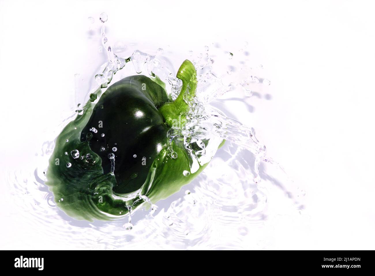 Green Bell Pepper Splashing Into Water Stock Photo - Alamy