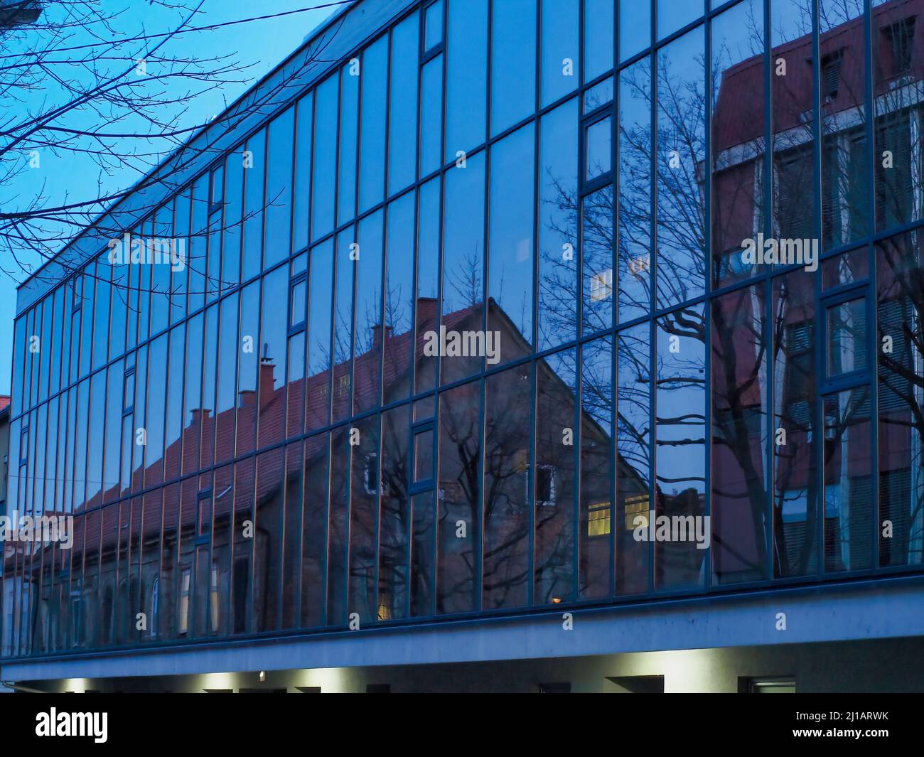 A scenic shot of a commercial building with the neighboring buildings ...