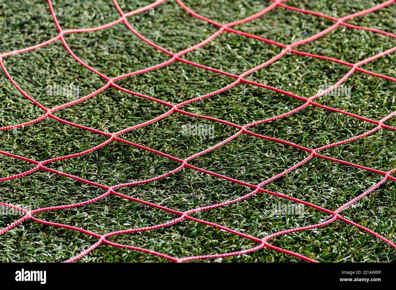 red netting of a football goal of an artificial turf field Stock Photo ...
