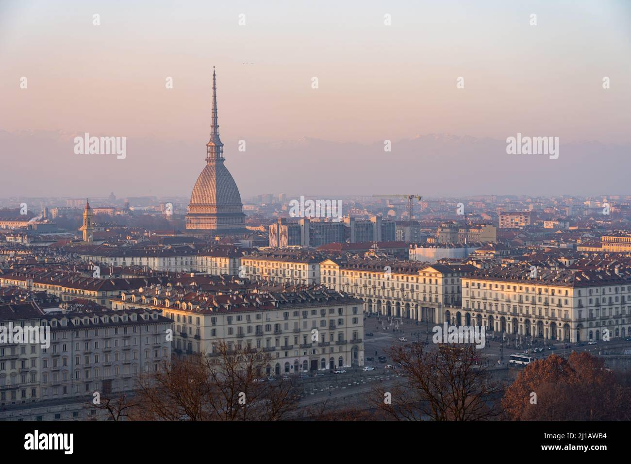 A foggy view of the center of Turin with the landmark Mole Antonelliana ...
