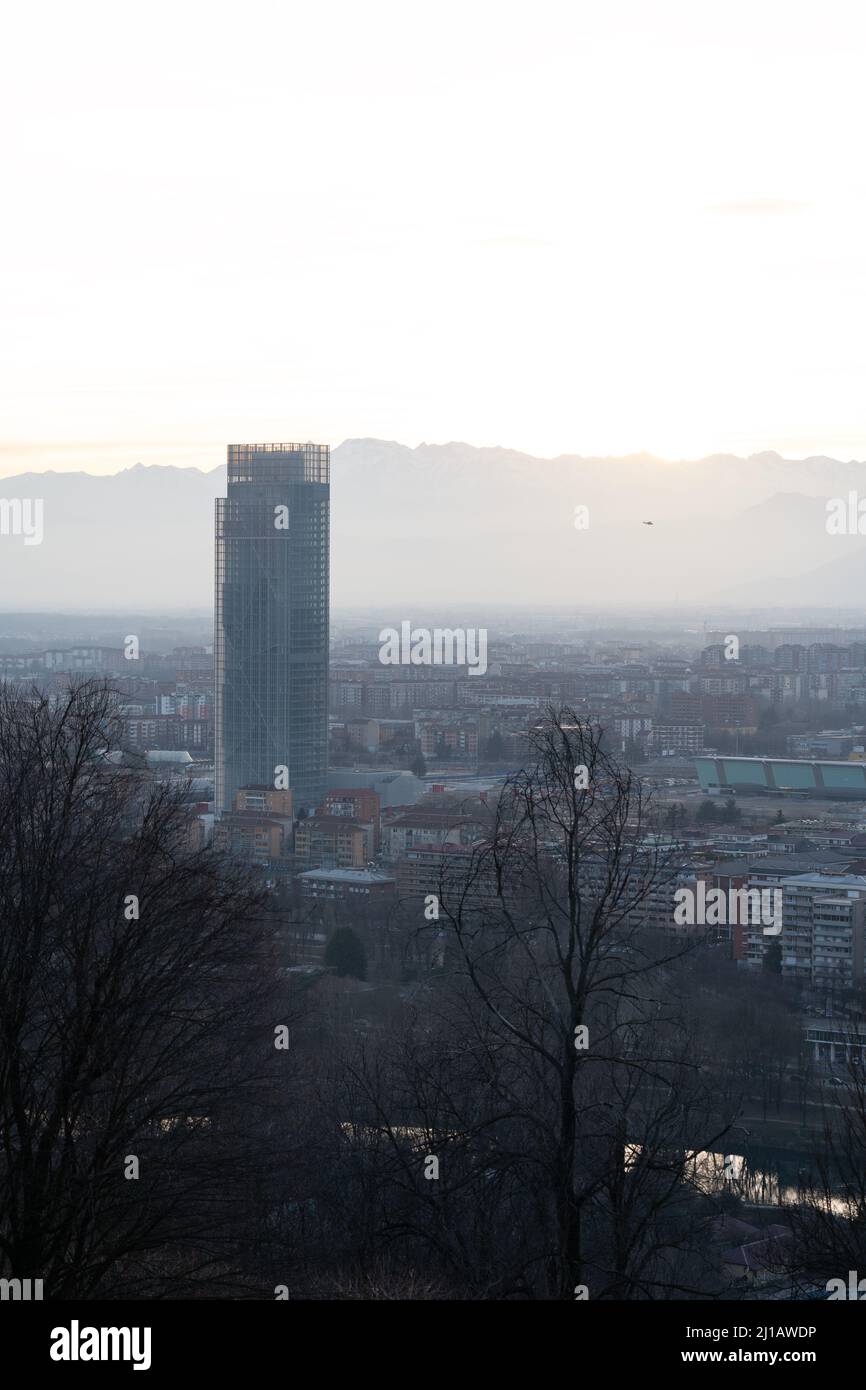 A Vertical, foggy shot of a skyscraper in the Piedmont area, Turin ...