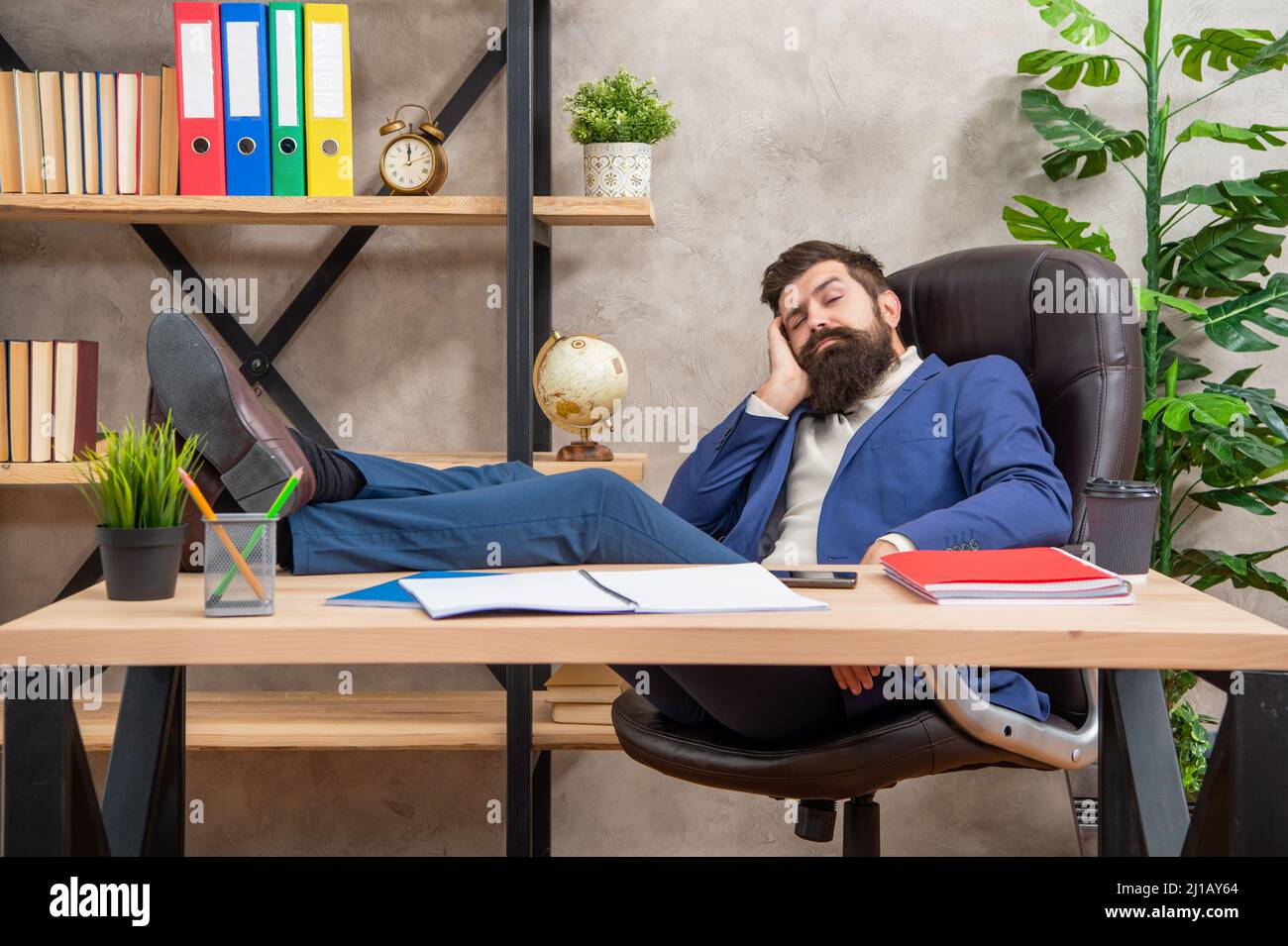 Rest and be thankful. Tired boss relaxing in desk chair. Rest break ...