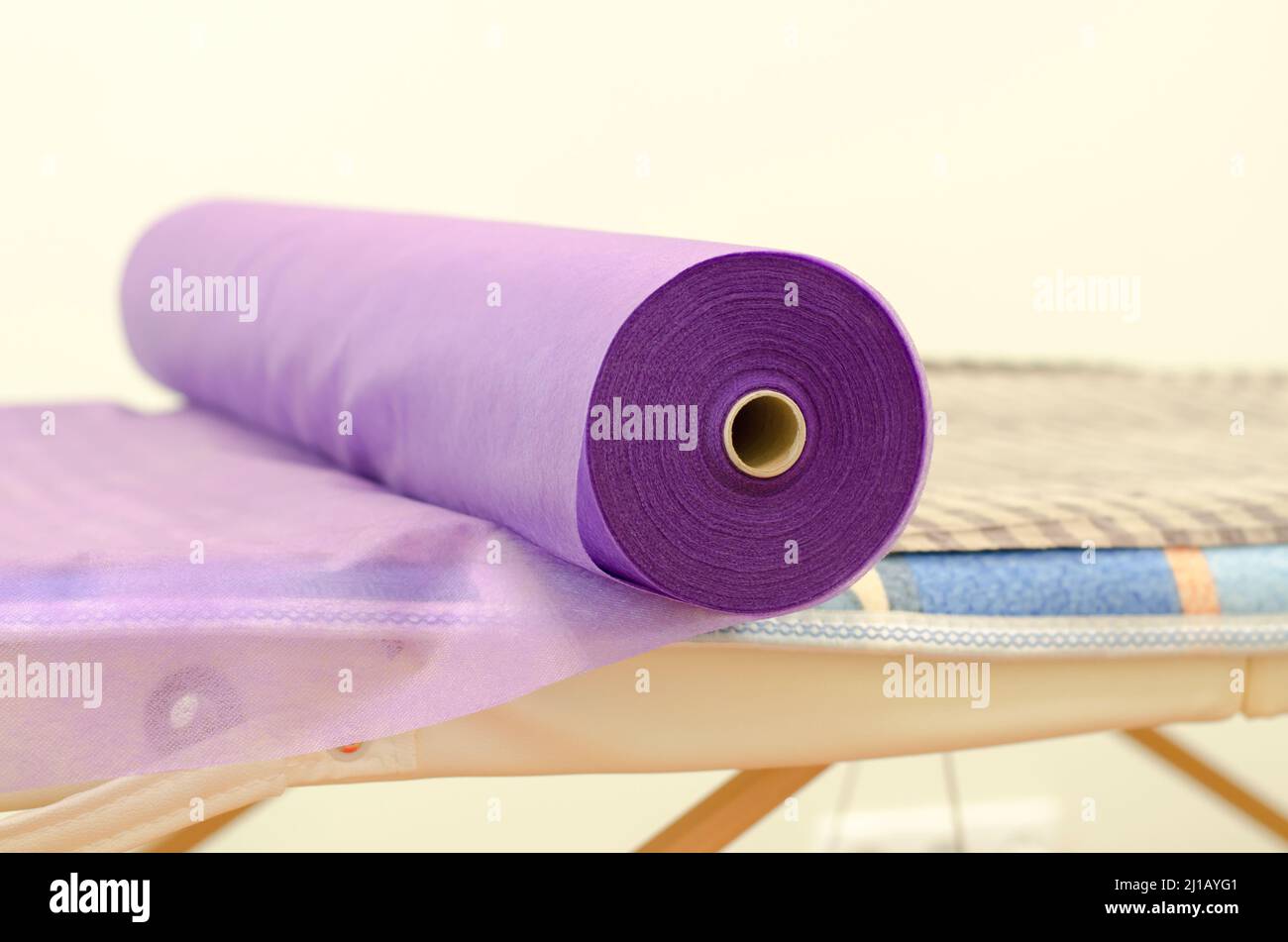 A roll of disposable sheets on a massage table, close-up, side view ...