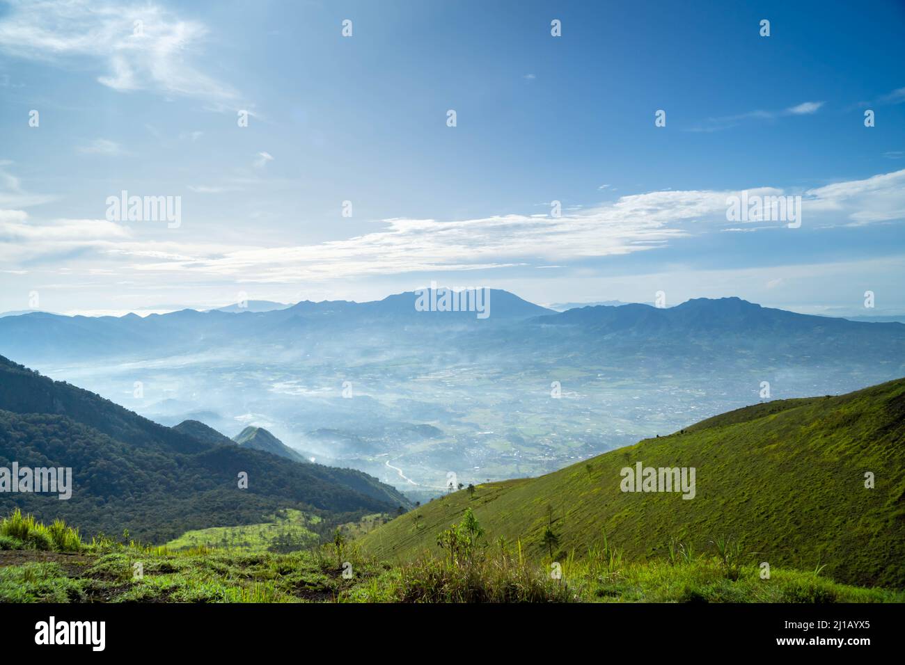 View of Indonesia's mountains with wide green grass Stock Photo - Alamy