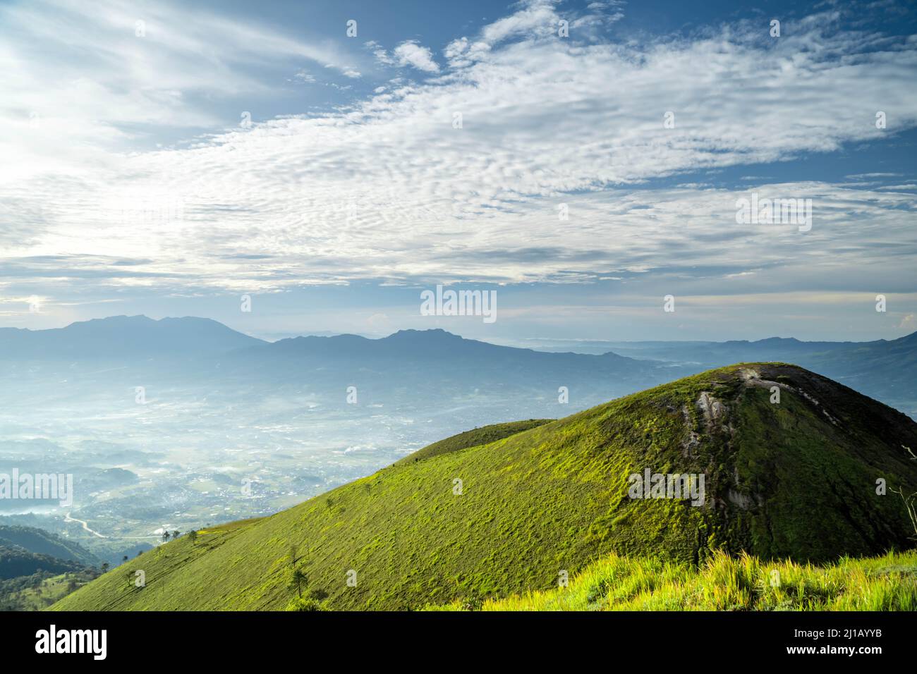 View of Indonesia's mountains with wide green grass Stock Photo - Alamy