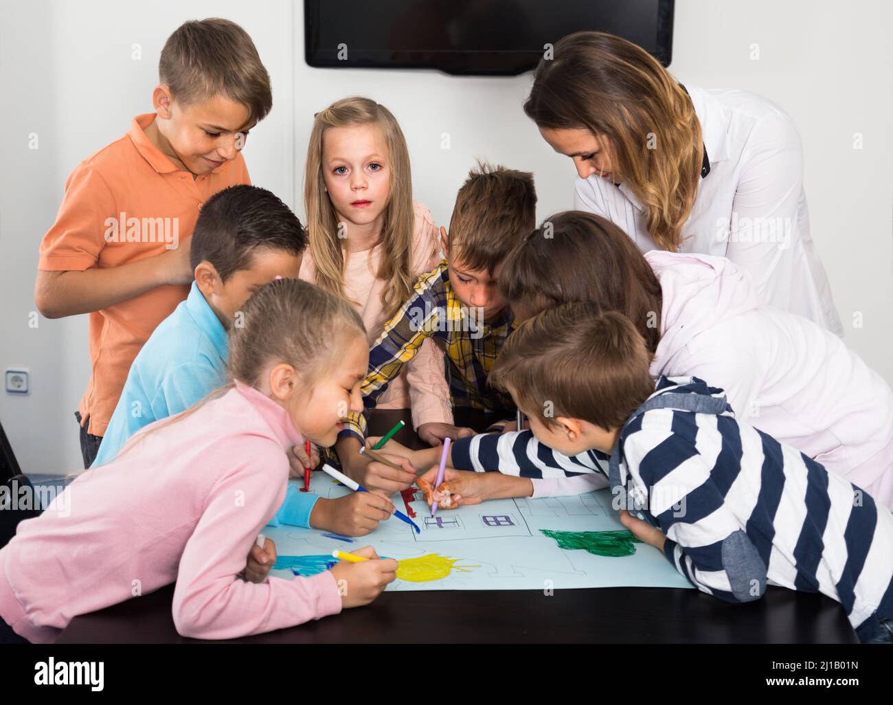 Professor and children drawing Stock Photo - Alamy