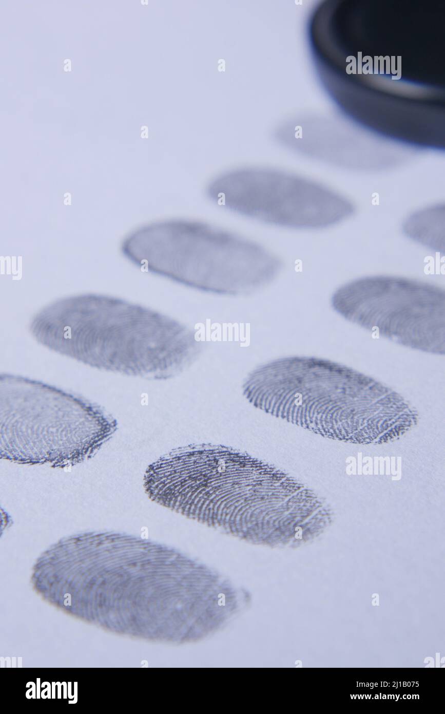 different black fingerprints on a paper close up Stock Photo - Alamy