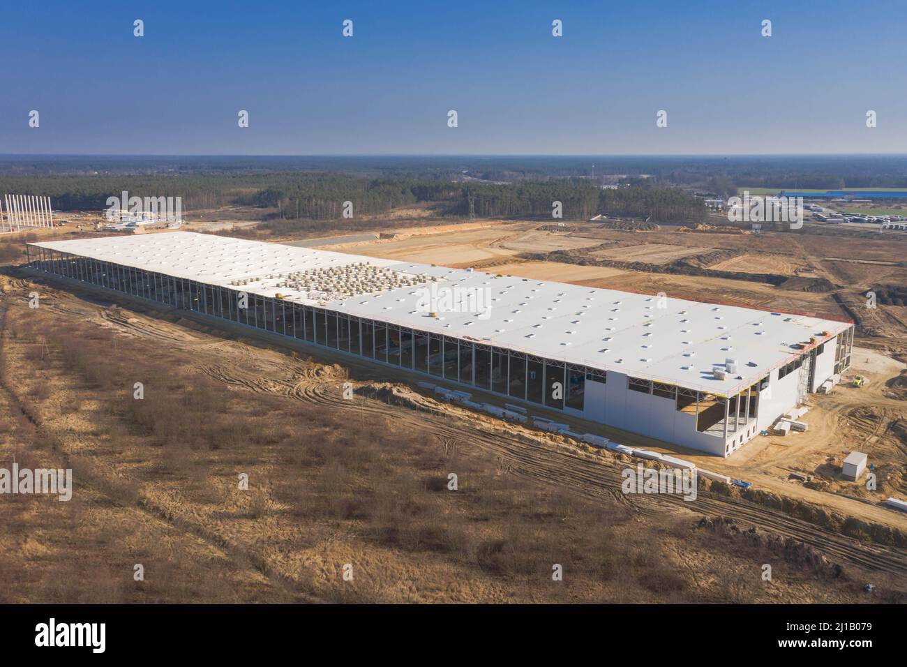 Vast plain, construction site, construction of a large industrial hall ...