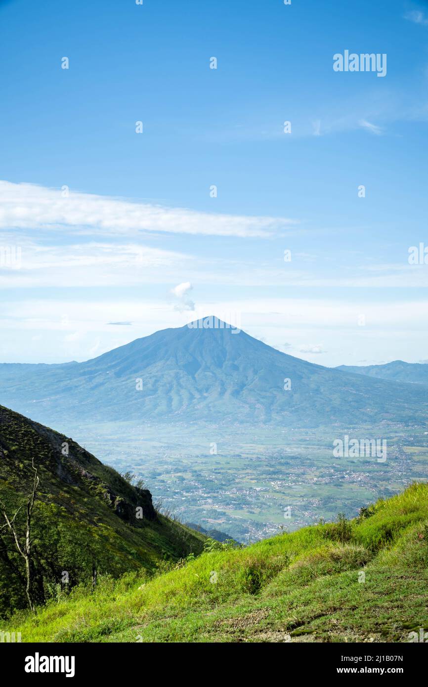 View of Indonesia's mountains with wide green grass Stock Photo - Alamy