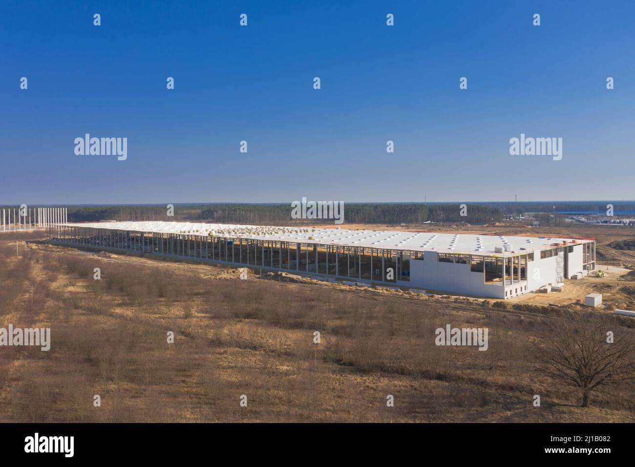 Vast plain, construction site, construction of a large industrial hall ...