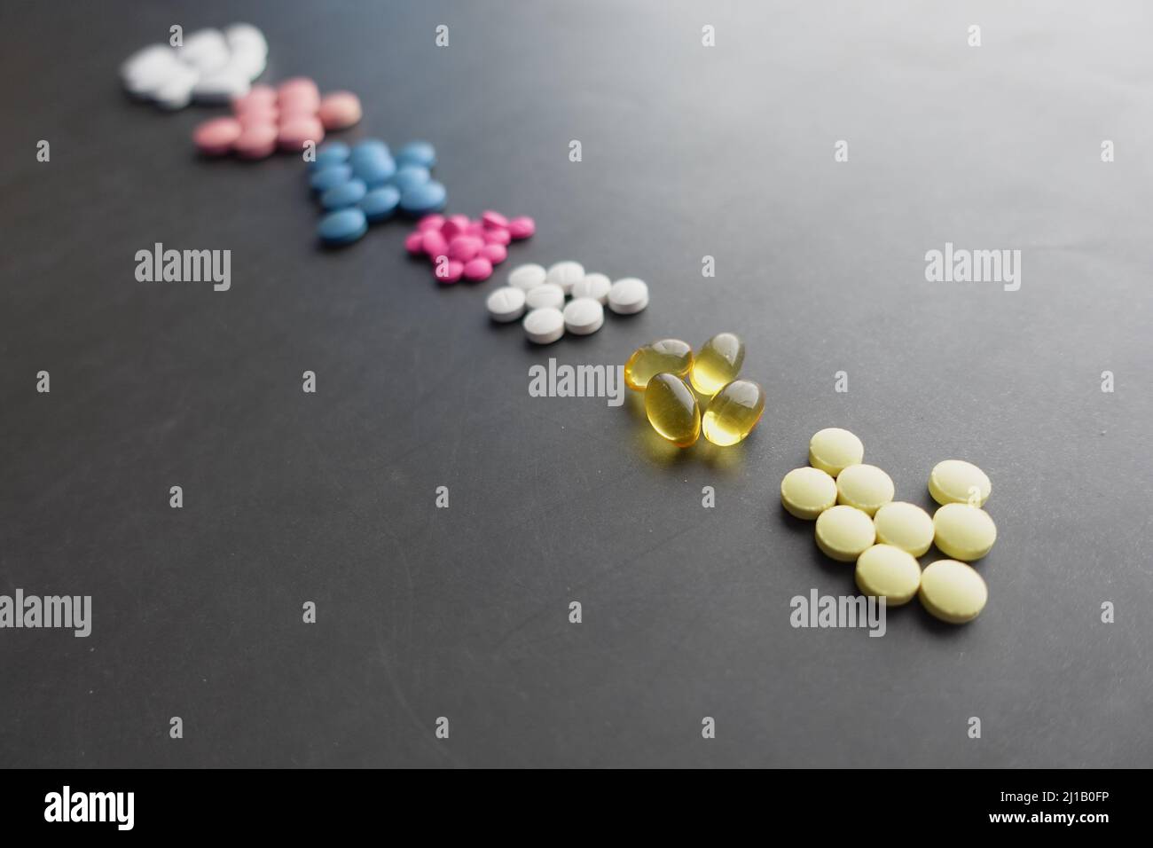 Close up pills capsules spilling hi-res stock photography and images ...