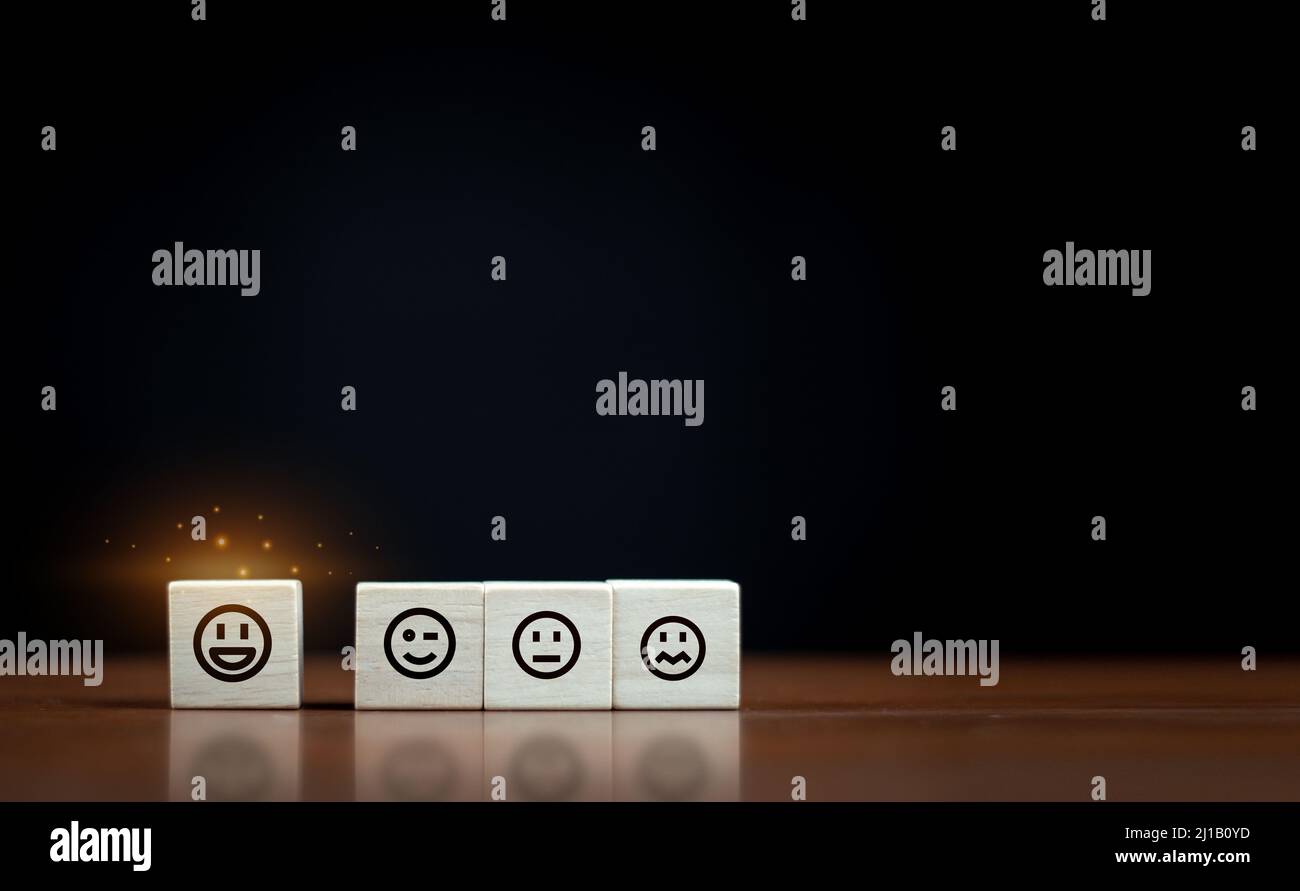 Wooden blocks with the happy face smile face symbol on the table ...