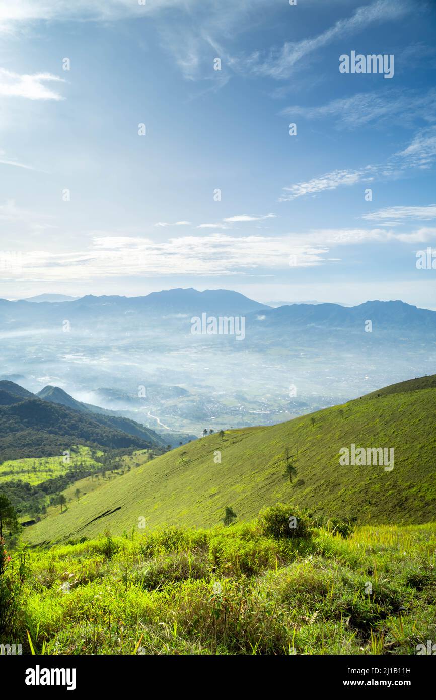 View of Indonesia's mountains with wide green grass Stock Photo - Alamy