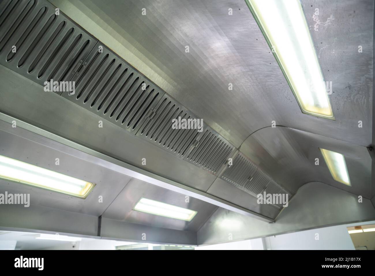 hood in restaurant kitchen of a professional kitchen. Modern kitchen ...