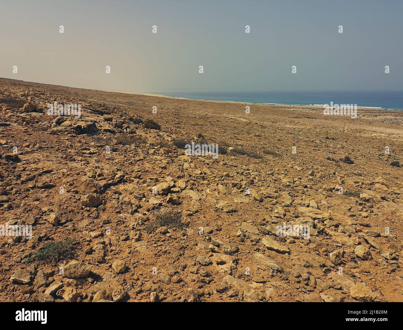 A rough rocky surface of a desert in the daytime Stock Photo - Alamy