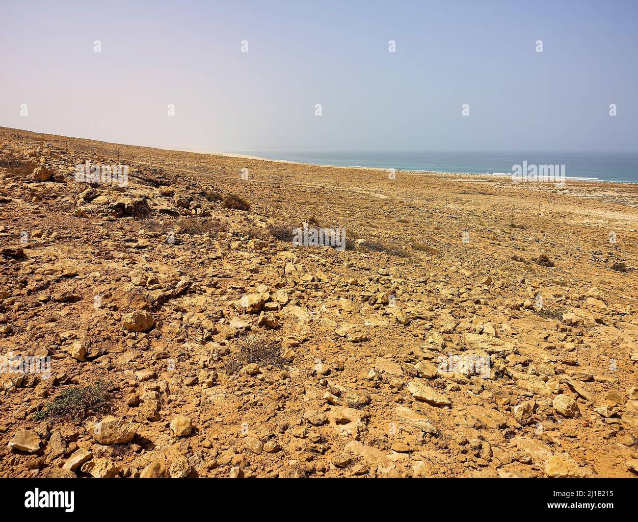 A rough rocky surface of a desert in the daytime Stock Photo - Alamy