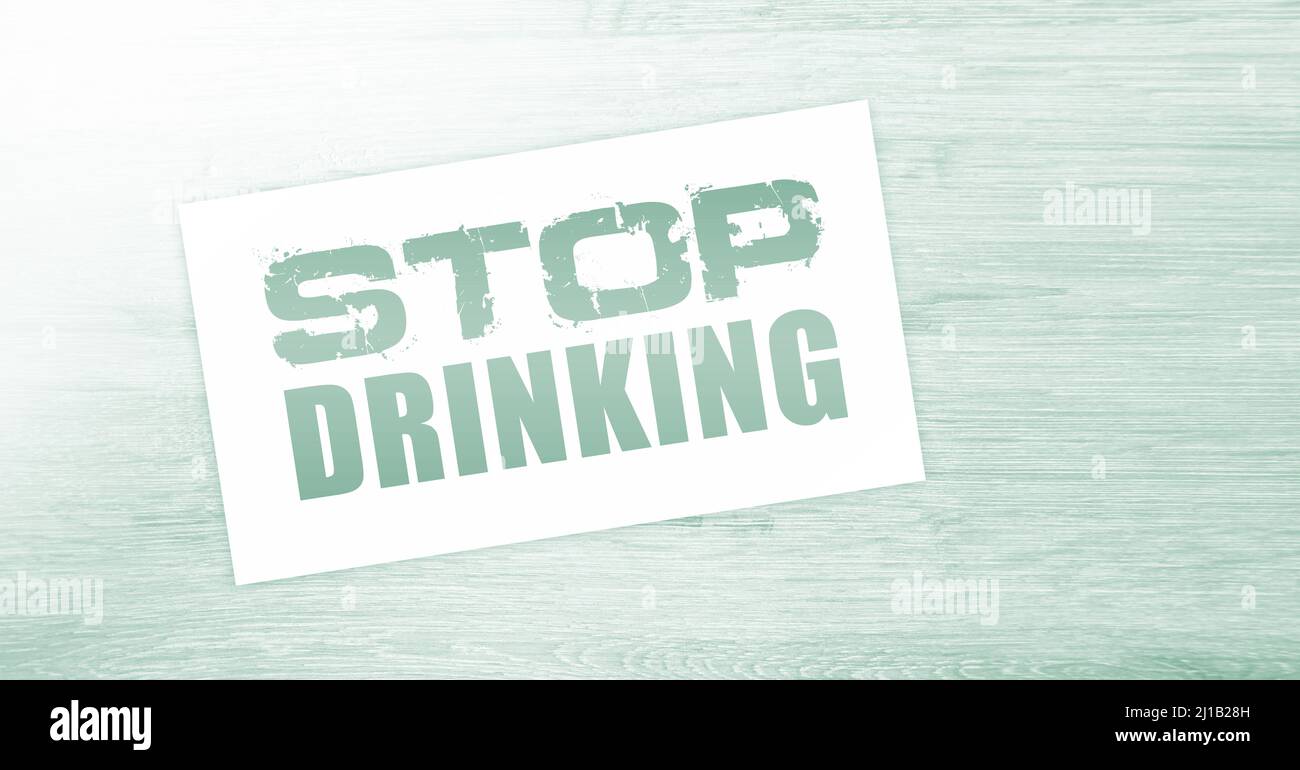 Stop drinking words on card on wooden table. Addictions healthcare ...