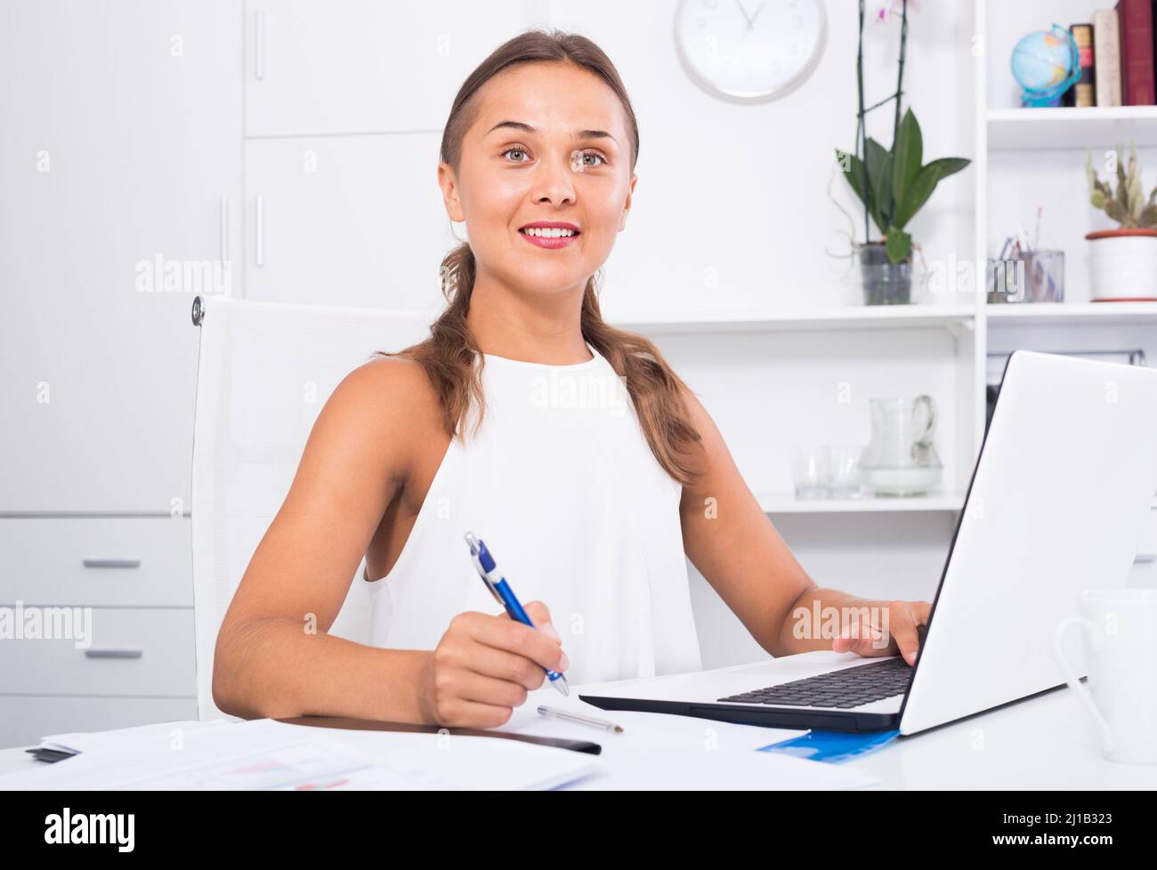Cheerful female secretary typing hi-res stock photography and images ...