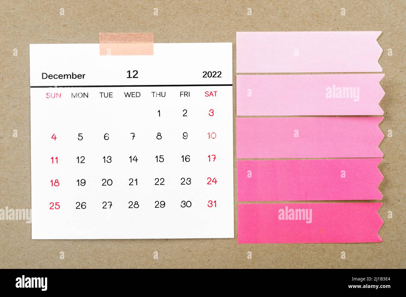 The December 2022 calendar with blank adhesive note paper on brown ...