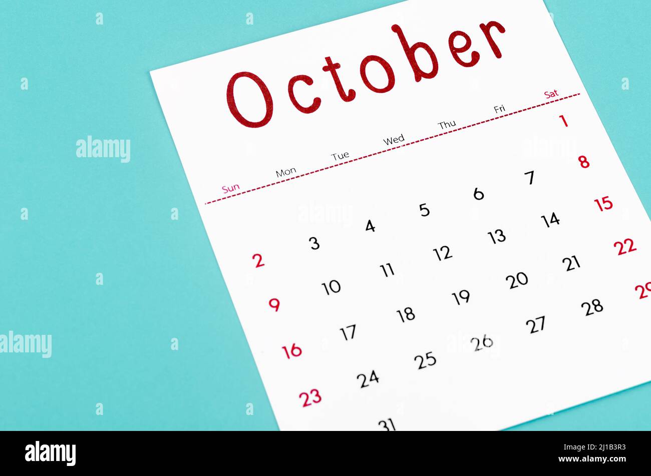 Close up October 2022 calendar sheet on light blue background Stock ...