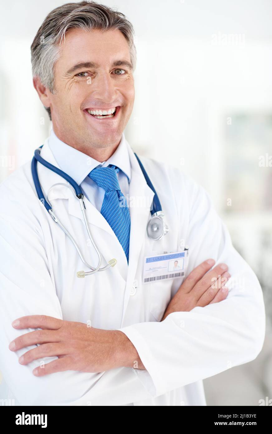 Someone you can trust. Portrait of a male doctor standing in a hospital ...