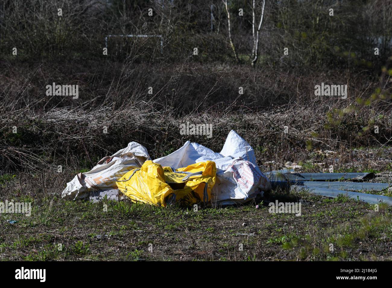 builders bags dumped in a field Stock Photo - Alamy
