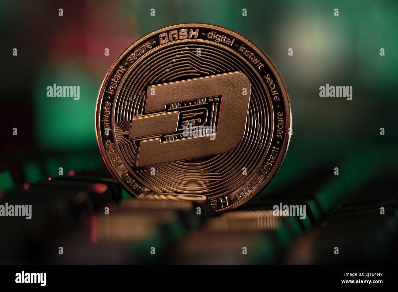 Dash cryptocurrency physical coin placed on the computer keyboard and ...
