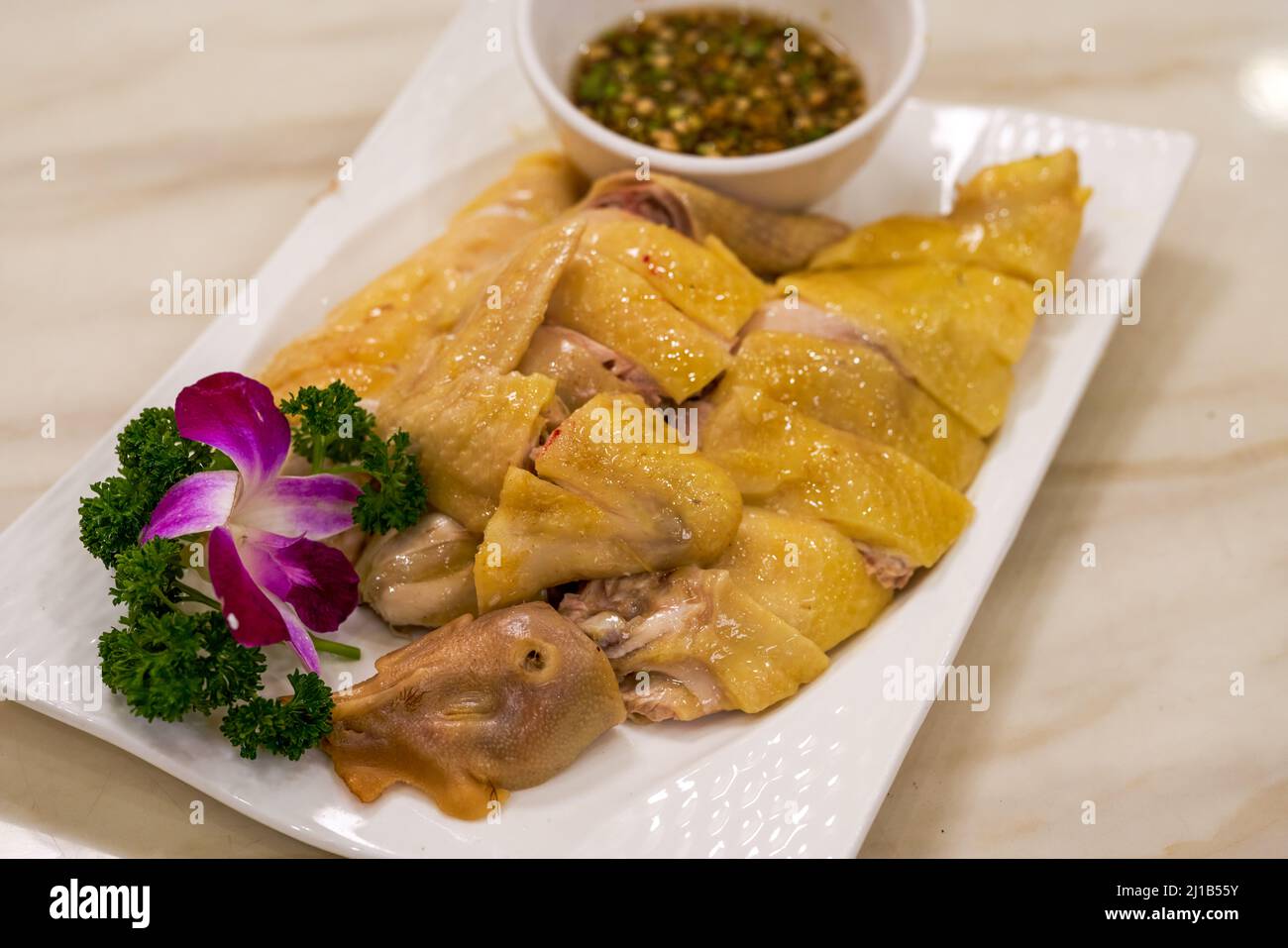 A fresh and delicious traditional Cantonese dish, white cut chicken ...