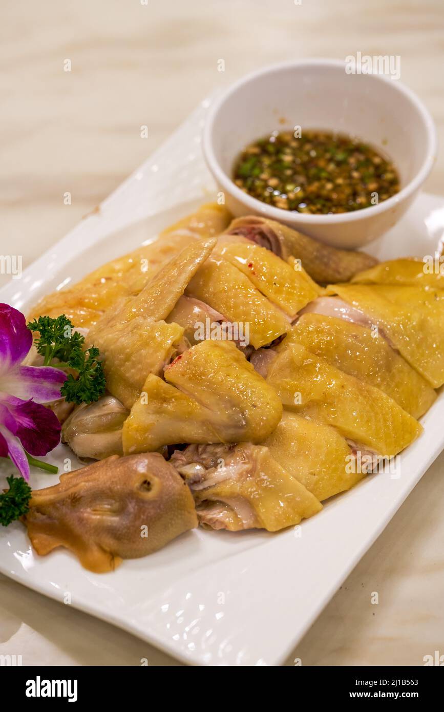 A fresh and delicious traditional Cantonese dish, white cut chicken ...