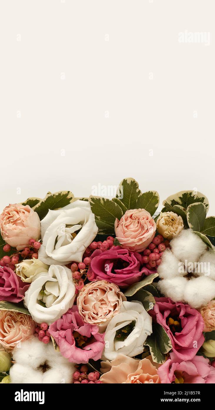 Closeup of bouquet of flowers in rustic style on white background ...