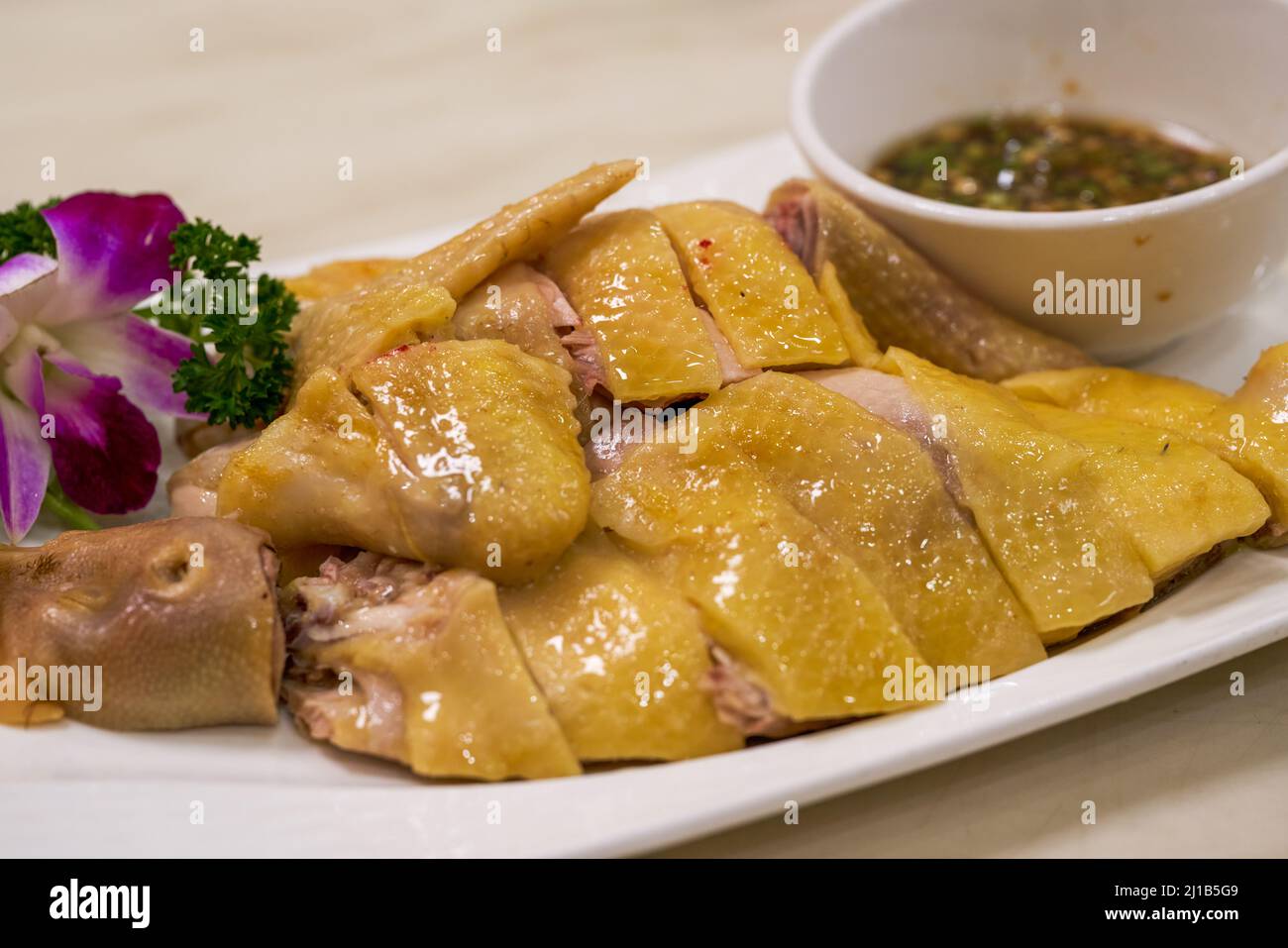 A fresh and delicious traditional Cantonese dish, white cut chicken ...