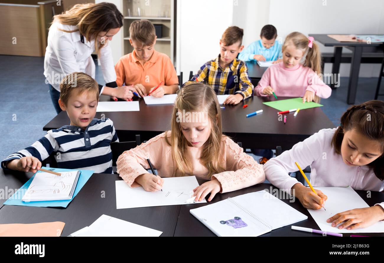 Children listening classroom uniform hi-res stock photography and ...