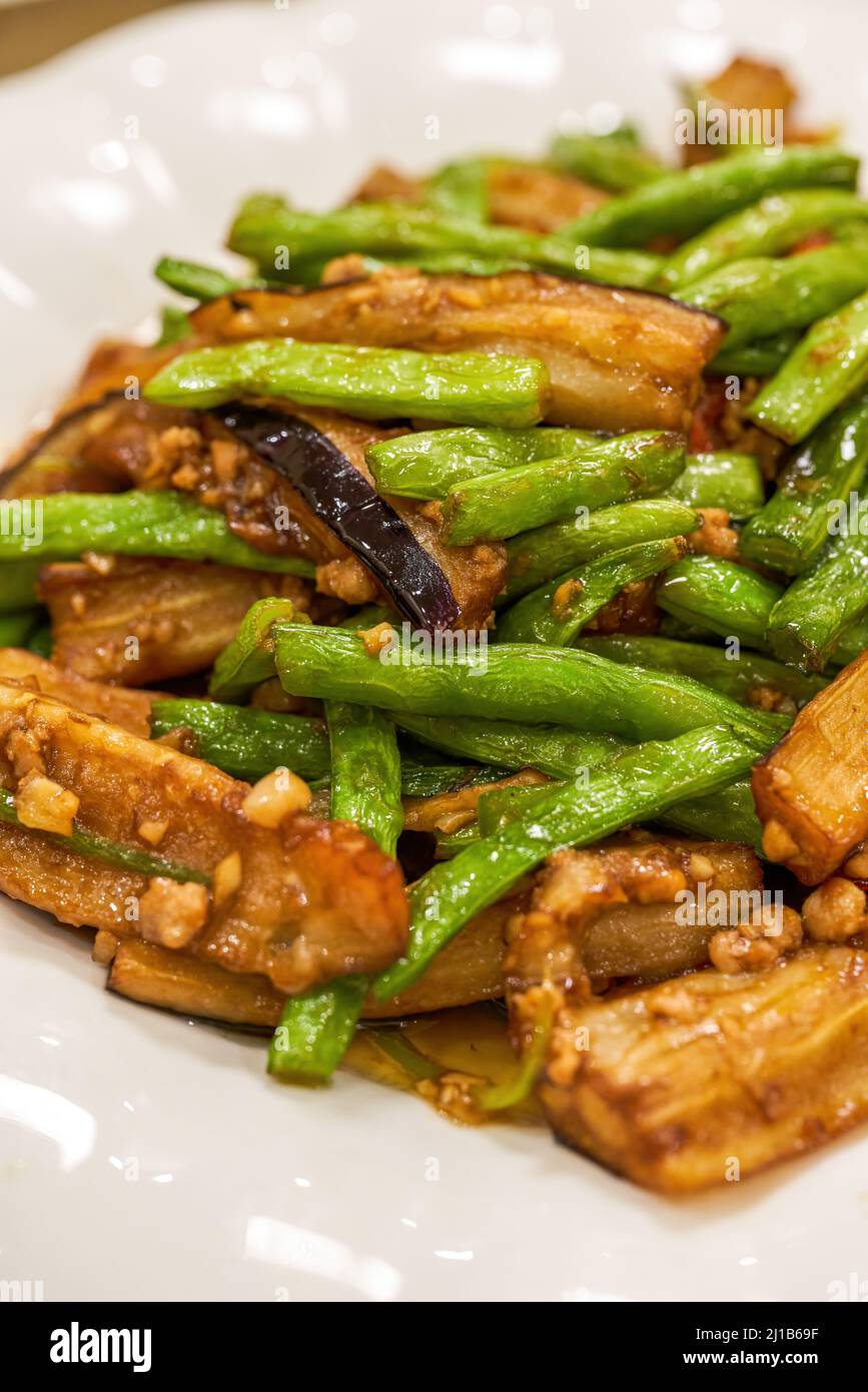 A delicious Chinese dish, Braised Beans with Eggplant Stock Photo - Alamy