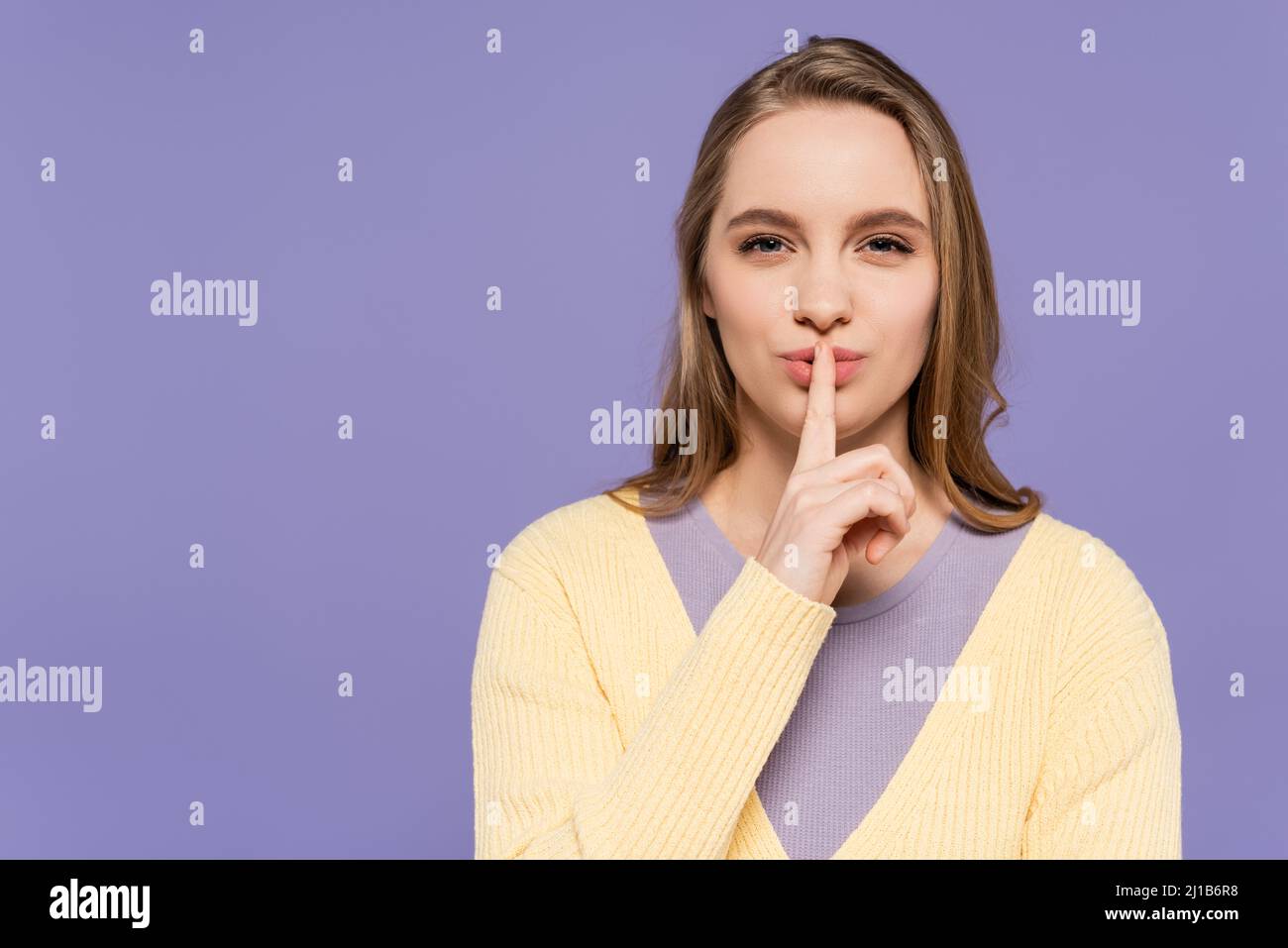 Beautiful woman show hush sign hi-res stock photography and images - Alamy