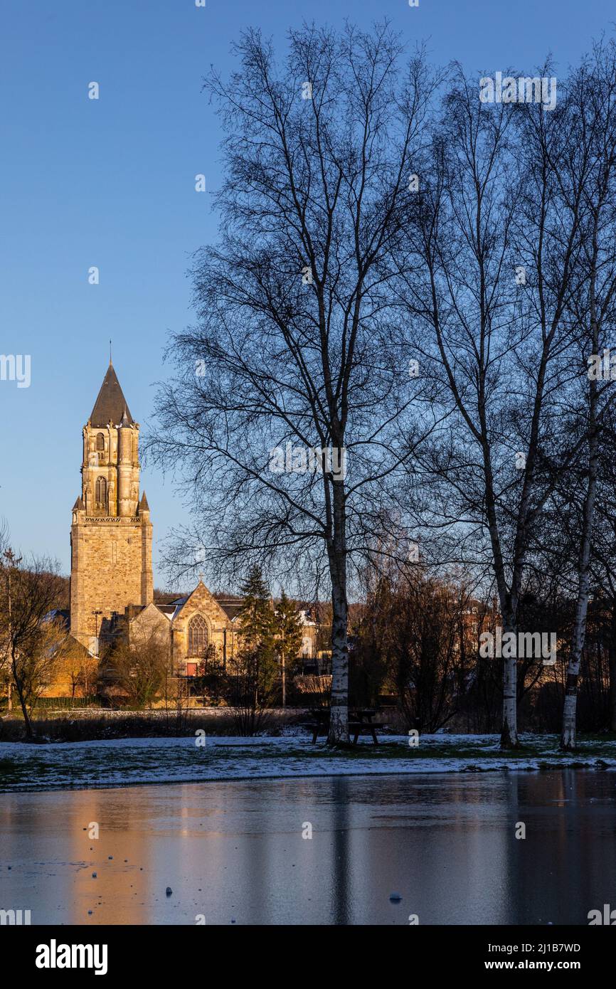 FROZEN LAKE IN FRONT OF THE NOTRE-DAME CHURCH, ORBEC, CALVADOS, FRANCE ...