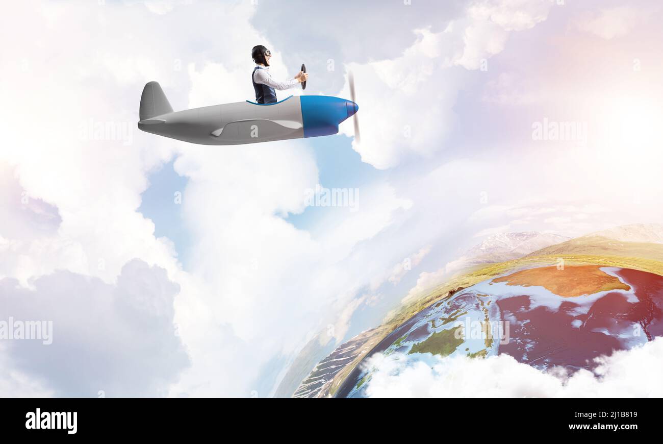 Aviator in leather helmet driving small plane Stock Photo - Alamy