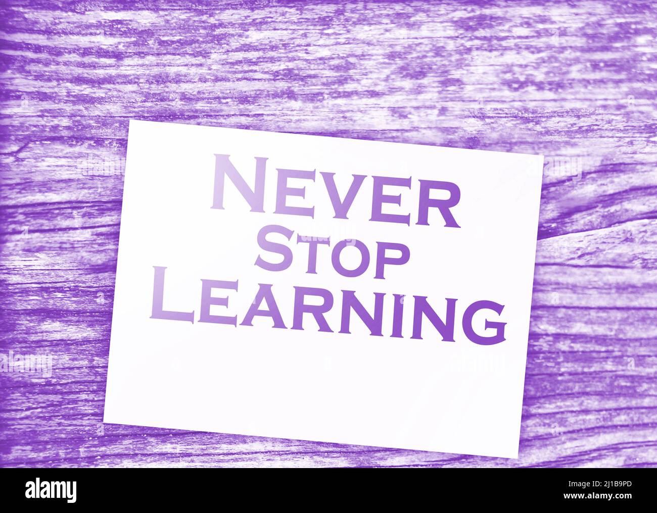 Text never stop learning on page and paper dollar signs around on ...