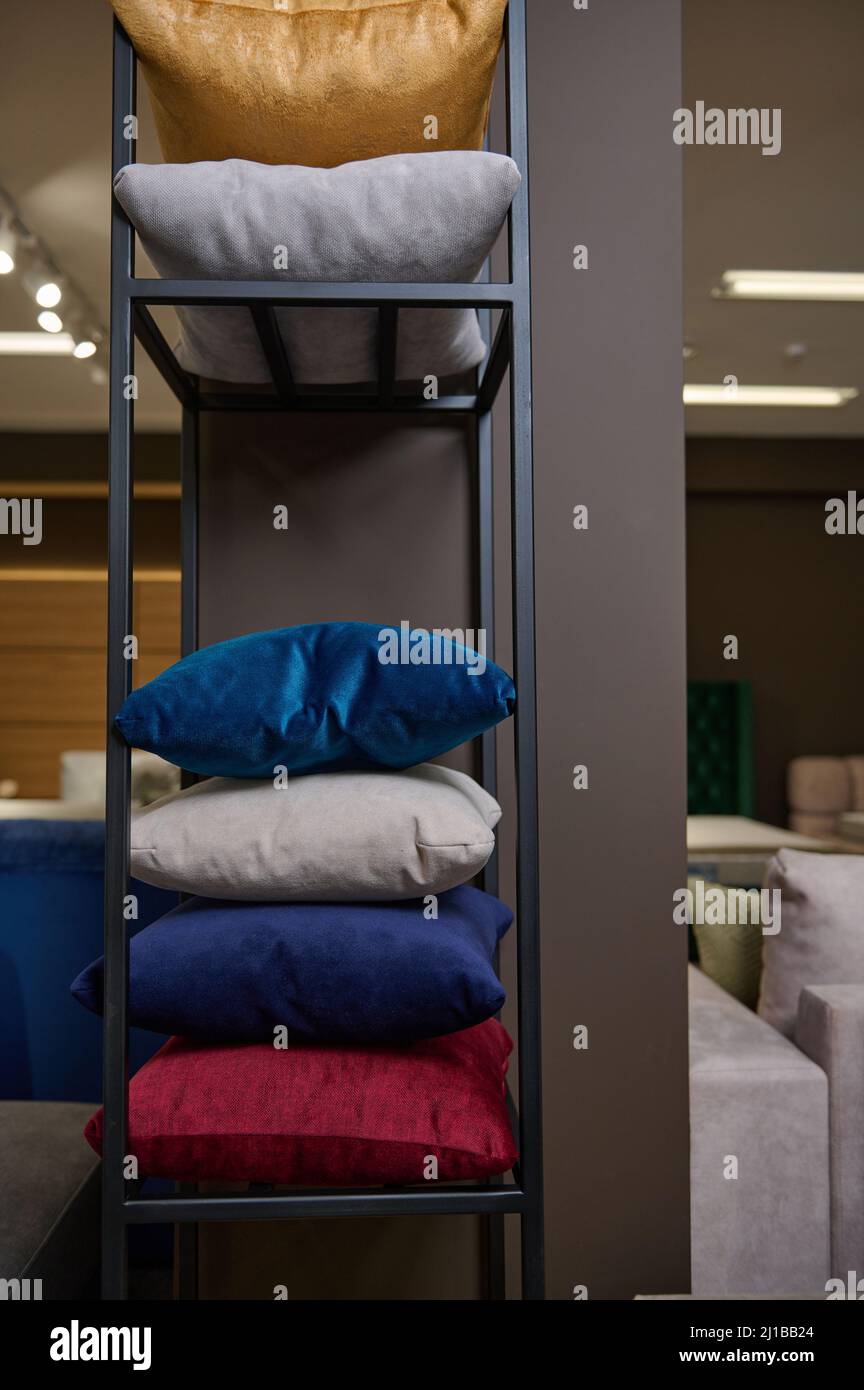 Velour colorful cushions for a sofa on an exhibition stand in a ...