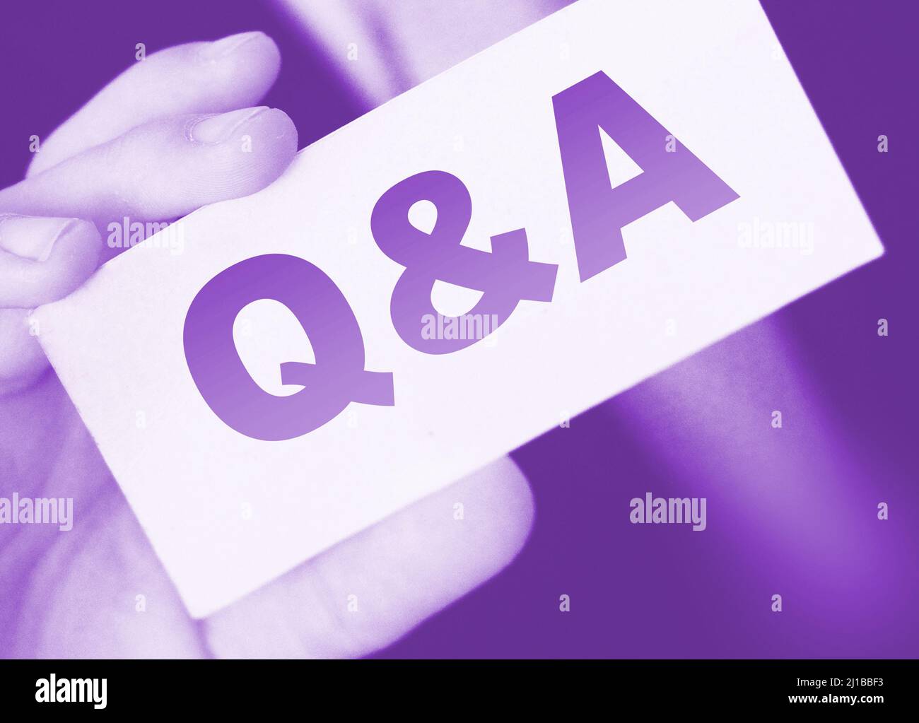 Q and A Questions and Answers sign on business card shown by a ...