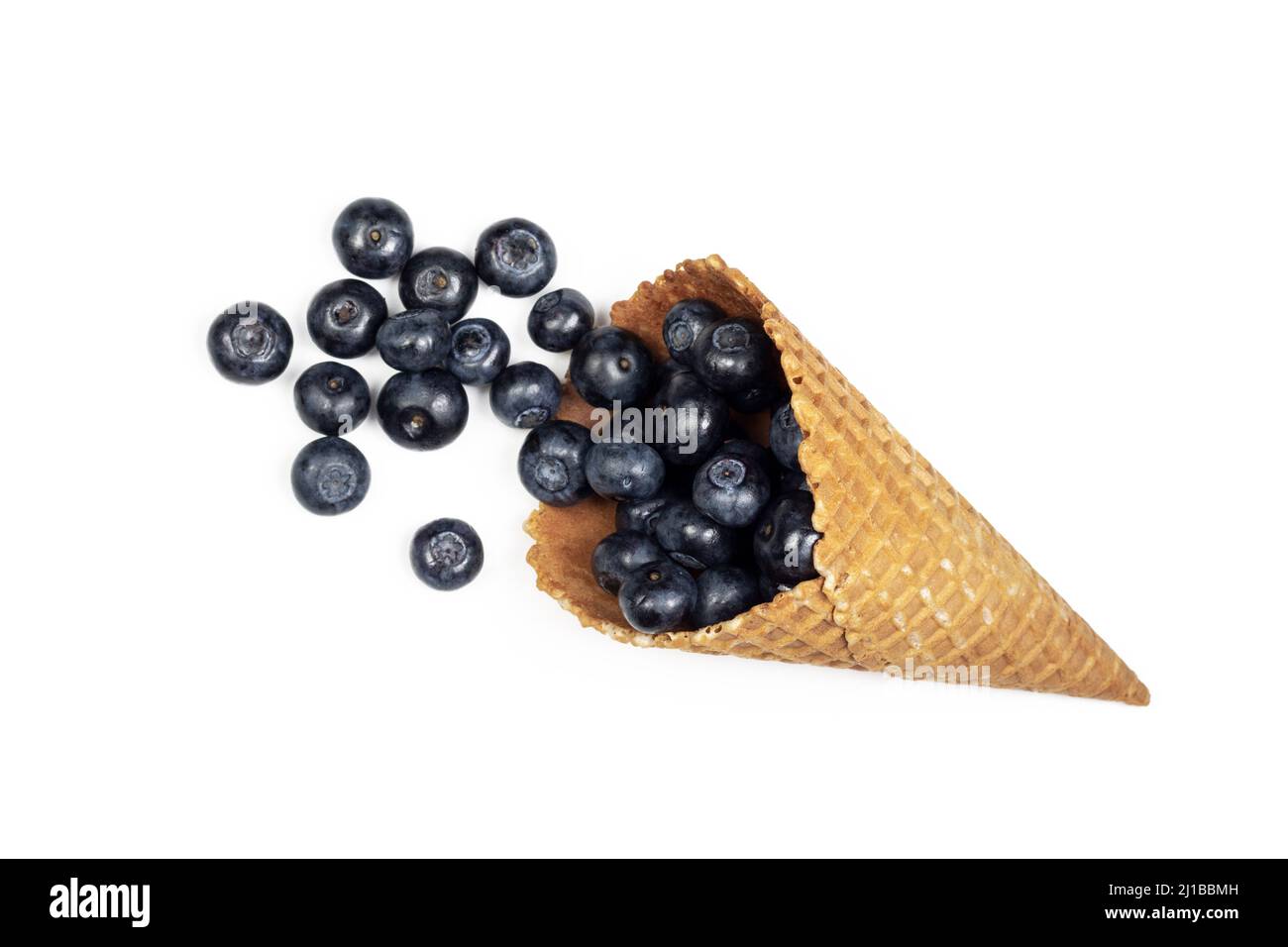 Fresh ripe blueberry in waffle cone. Ice cream cone with ripe sweet ...