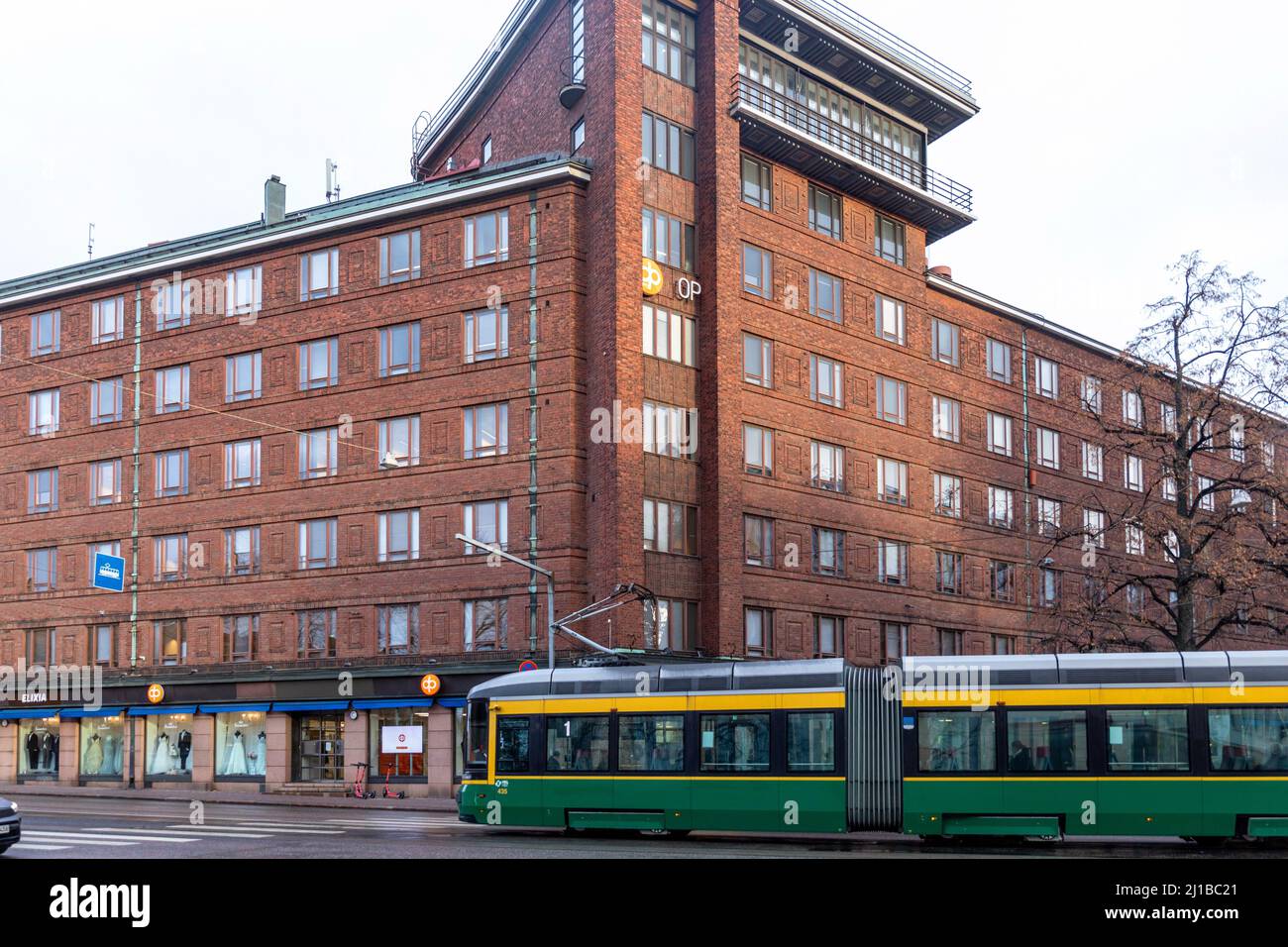 TRAMWAY IN FRONT OF THE RED BRICK BUILDINGS TYPICAL OF FINNISH ...